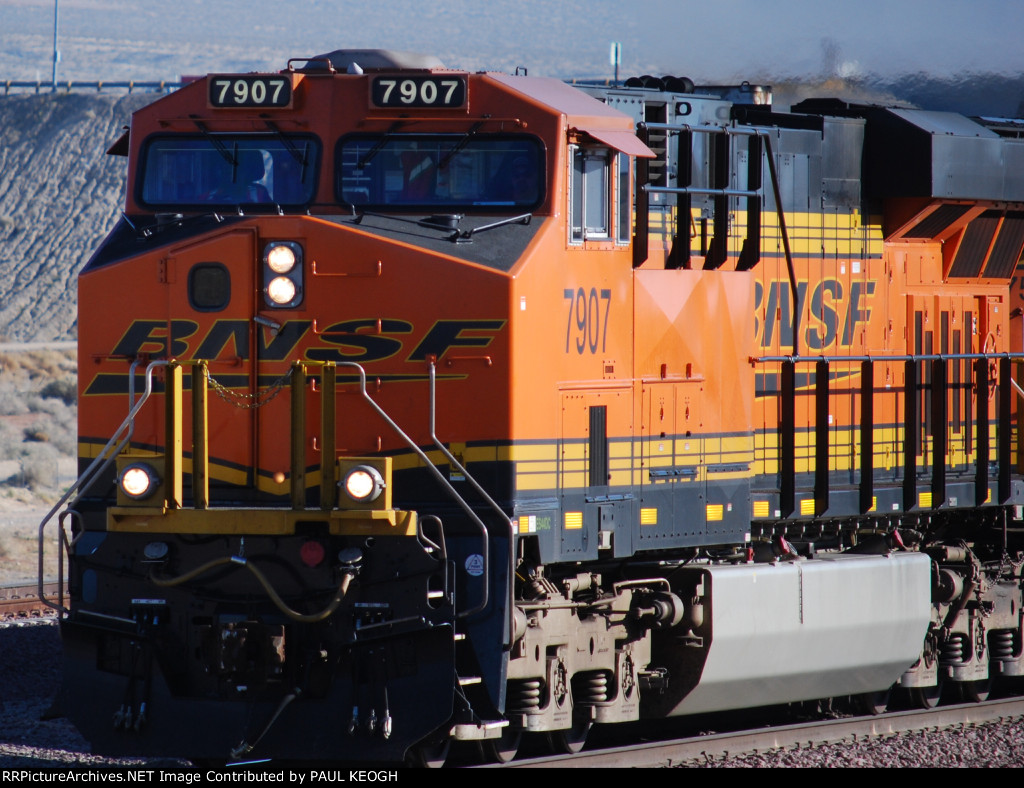 BNSF 7907 heads!west leading a Z-Train in this close up shot of the crew in the cab.